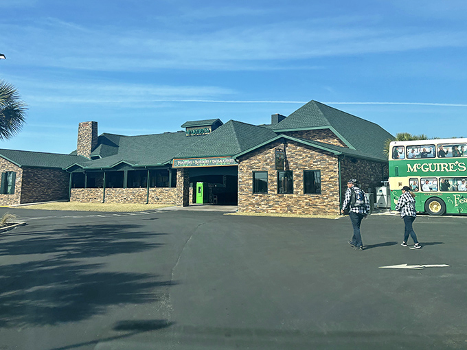 On sunny days, McGuire's stone exterior looks even more inviting. That green door might as well be a portal directly to Dublin—just with better weather.