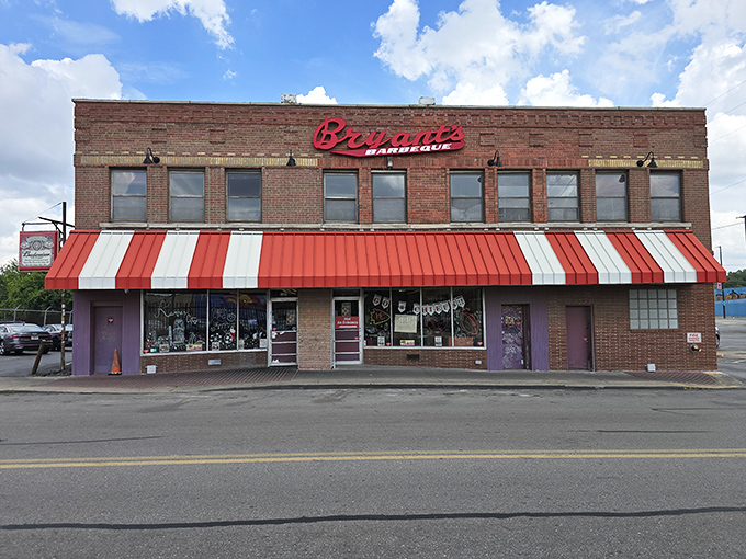 The striped awning and brick facade aren't trying to impress anyone&mdash;they don't need to when what's inside has already achieved barbecue immortality. 