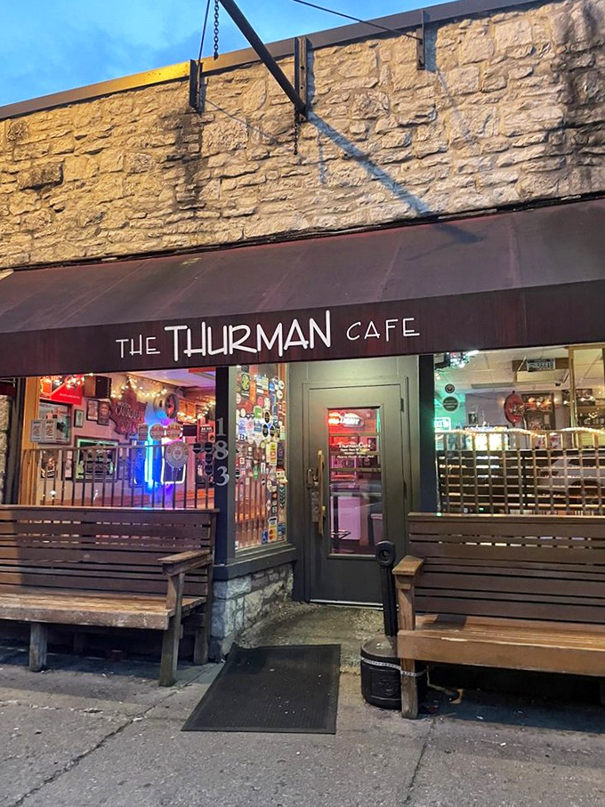 As evening falls, The Thurman Cafe's neon glow beckons hungry pilgrims like a lighthouse guiding ships to safe harbor. Except this harbor is full of burgers.