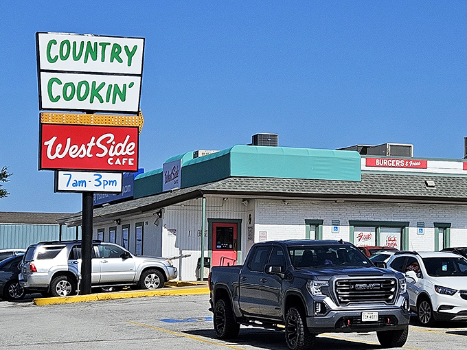 The vintage sign proudly announcing "Country Cookin'" makes a promise that the kitchen inside absolutely keeps. No false advertising here, folks.