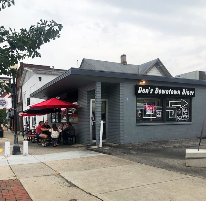 The storefront proudly advertising "Hamburgers, Milk Shakes, Gyro+Fries" isn't just signage&mdash;it's a haiku of happiness for hungry travelers.