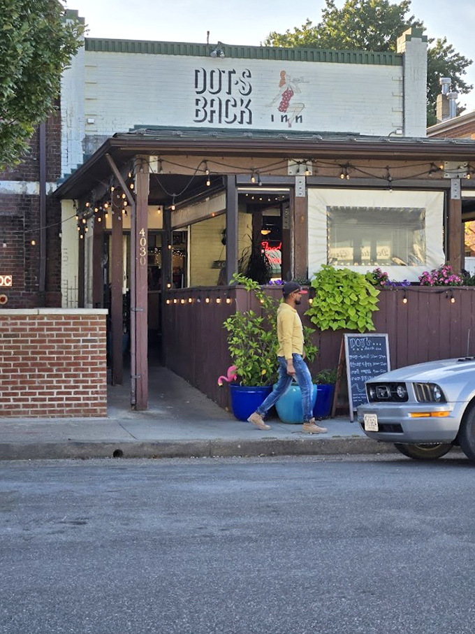 Dot's storefront at golden hour&mdash;when the white brick glows, string lights twinkle, and hungry Richmonders arrive for their comfort food fix.