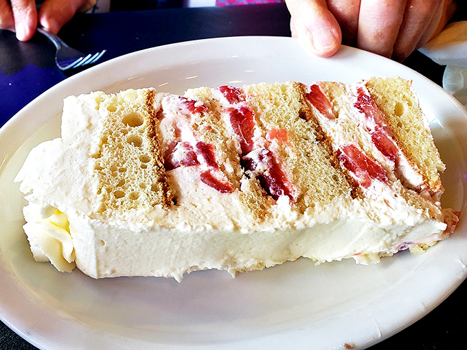 Strawberry cake that's worth every calorie and cardio minute. Diet plans have been abandoned for less temptation.