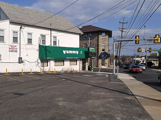 Corner location, cornerstone of the community. Yummy 2 stands as a neighborhood landmark where Baltimore Avenue meets breakfast excellence.