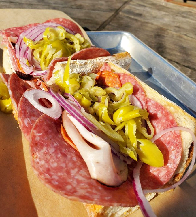 The Italian sandwich in all its glory – where layers of salami, provolone, and pepperoncini create a handheld masterpiece that demands to be savored slowly.