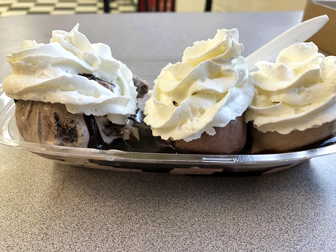 Three perfect scoops topped with clouds of whipped cream&mdash;proof that sometimes the simplest pleasures deliver the most profound happiness.