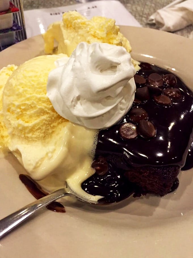 Hot fudge cascading over ice cream like delicious lava—proof that some desserts are worth every calorie and momentary guilt.