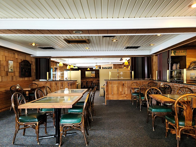 Another dining area showcases more of the restaurant's warm wooden charm. Comfortable seating arranged for conversation and connection—the perfect backdrop for memorable meals.
