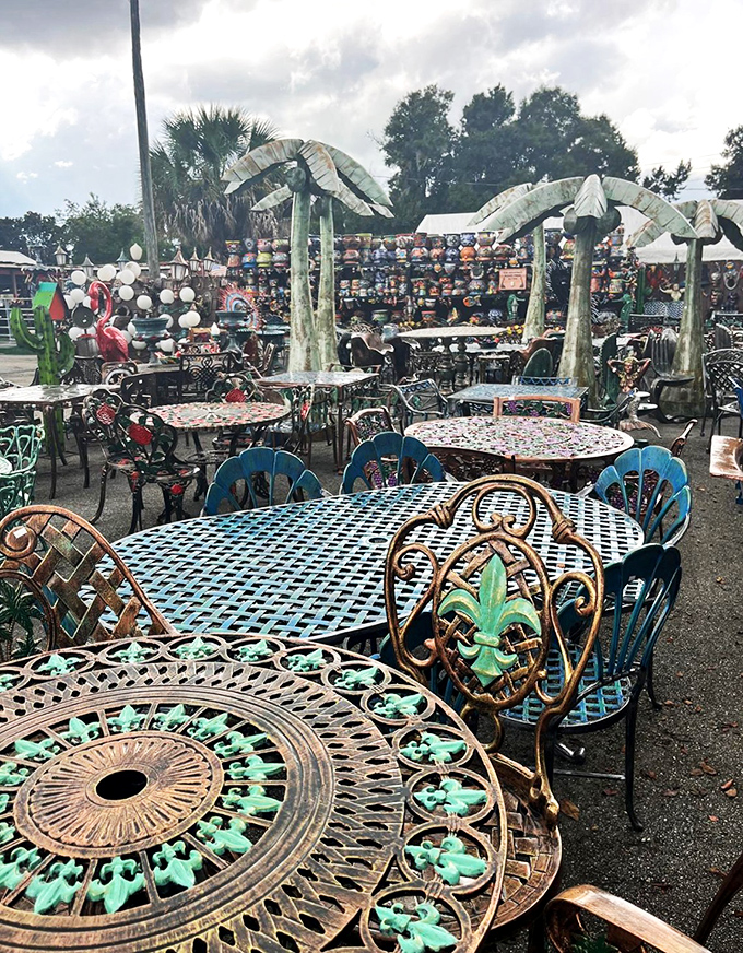Wrought iron tables with patina that can only come from time or artistic intention create an outdoor dining setting worthy of a magazine spread.