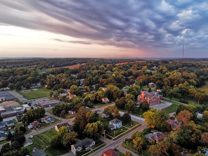 From above, Rock Port reveals itself as a patchwork quilt of homes, trees, and history, nestled in rolling hills under a dramatic Midwest sky that goes on forever.