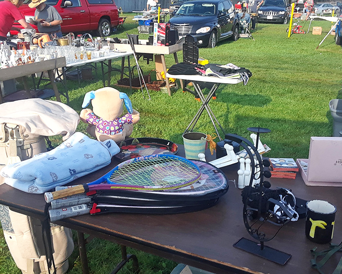 The Sunday flea market transforms the grounds into a treasure hunter's paradise. Tennis rackets, vintage toys, and mysterious gadgets await their new homes.