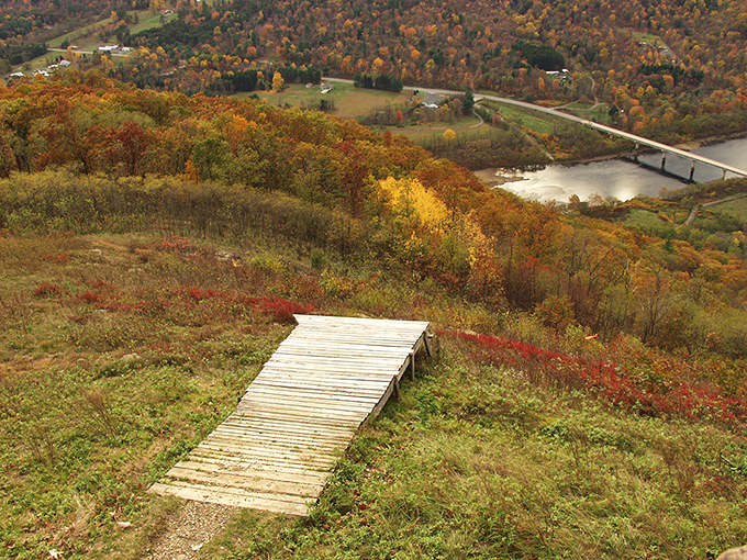 The hang glider launch ramp—where dreams take flight and stomachs drop. That short wooden runway represents the thin line between exhilaration and terror.