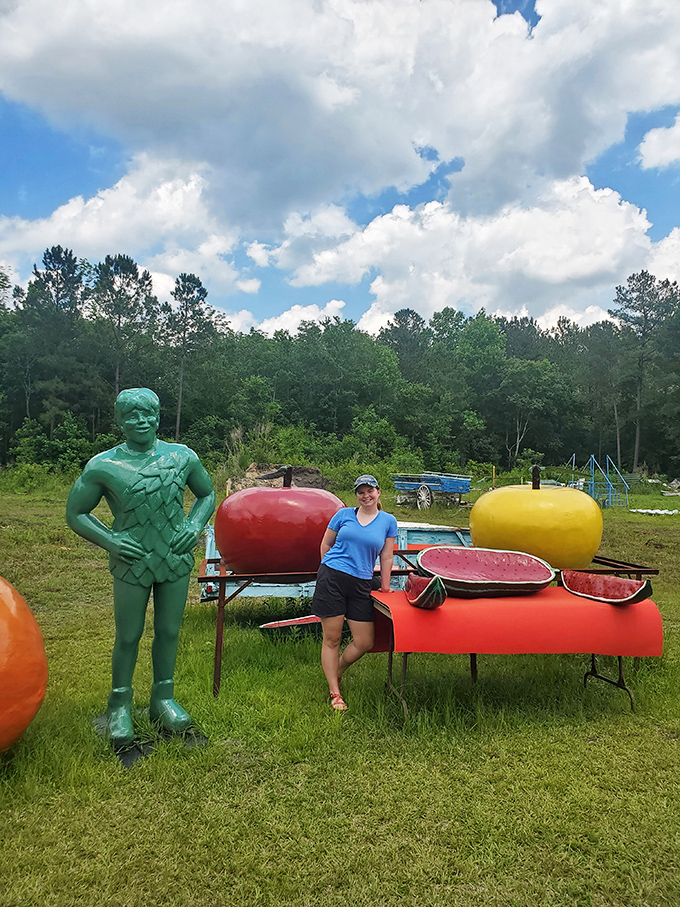 The Jolly Green Giant's cousin poses with giant fruit that would make any farmer proud. Proof that in Bolton, even the produce goes big.