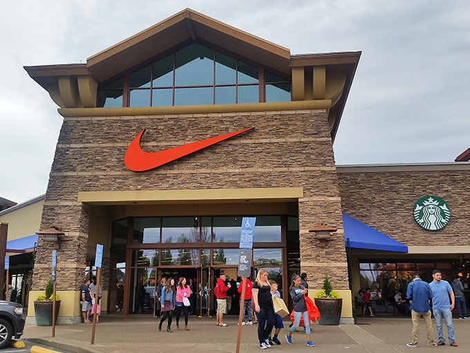 The Nike store entrance buzzes with activity as shoppers flock to Oregon's homegrown brand, proving that in the Beaver State, the swoosh is practically a state symbol.