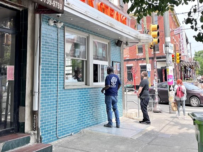 The walk-up window isn't just convenient&mdash;it's where impatient Philadelphians get their cheesesteak fix without missing a beat of city life.