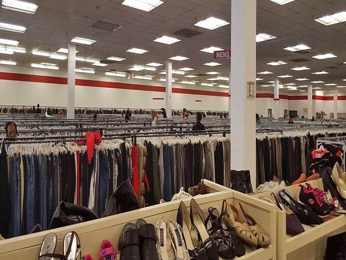 An ocean of clothing racks stretches to the horizon, with shoes patiently waiting in the foreground for their perfect match.