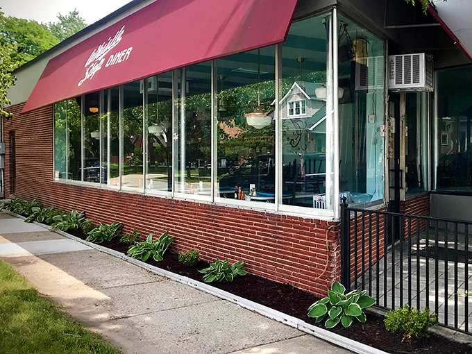 Large windows flood the space with natural light, creating the perfect environment for both people-watching and pancake appreciation.