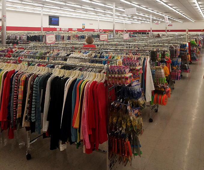 A rainbow of possibilities hangs in orderly rows. The women's clothing section proves that sustainable fashion can also be stylish and affordable.