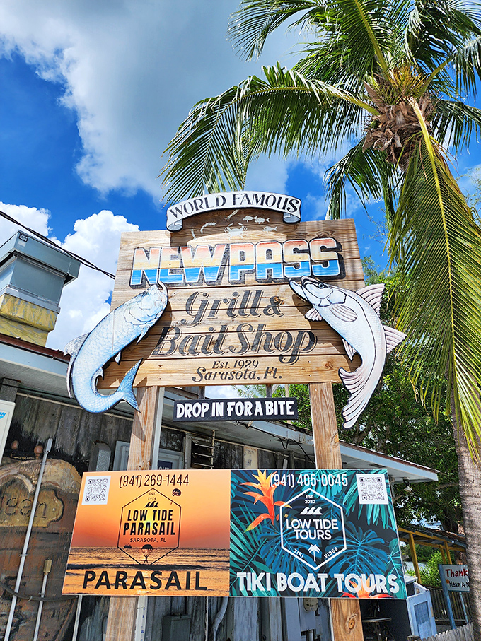 The wooden sign flanked by fish silhouettes marks one of Sarasota's oldest love affairs – between hungry humans and fresh seafood.