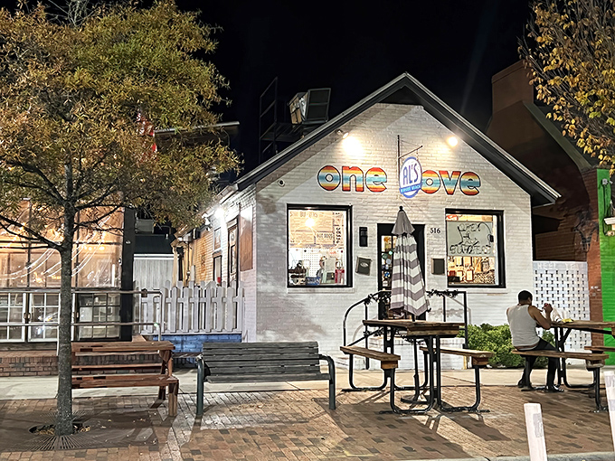 Al's Burger Shack at night, glowing with promise. That "one love" sign isn't just decoration&mdash;it's a burger philosophy in action.