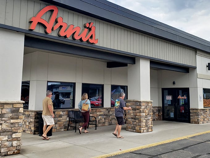 Arni's welcomes hungry pizza lovers with its iconic red sign, promising a taste of Lafayette tradition behind those doors.