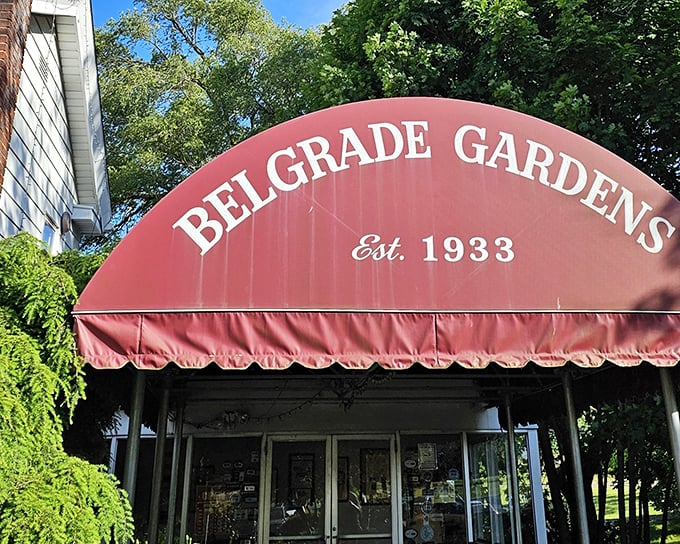 The iconic red awning of Belgrade Gardens, serving Barberton-style chicken since 1933. A landmark that's worth every mile of the journey.