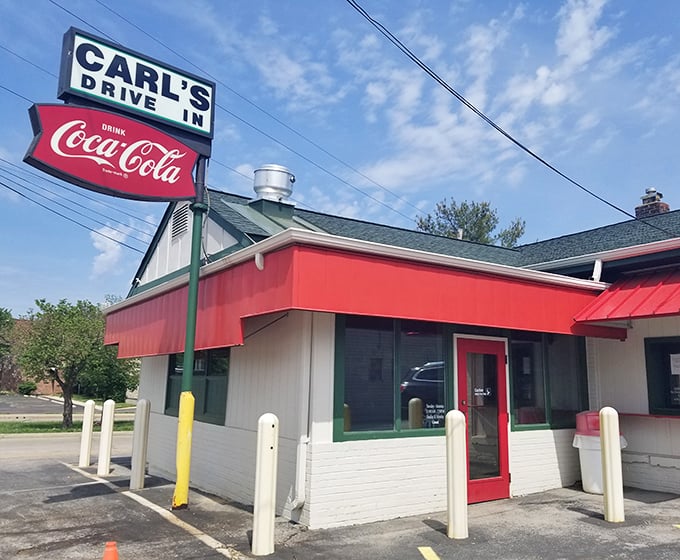 The iconic Carl's Drive-In sign promises a trip back to simpler times when burgers were king and Coca-Cola came in glass bottles.