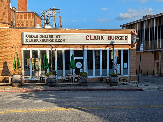 Clark Burger's storefront promises burger bliss with its simple charm. The wooden barrels outside hint at the laid-back vibe waiting inside.