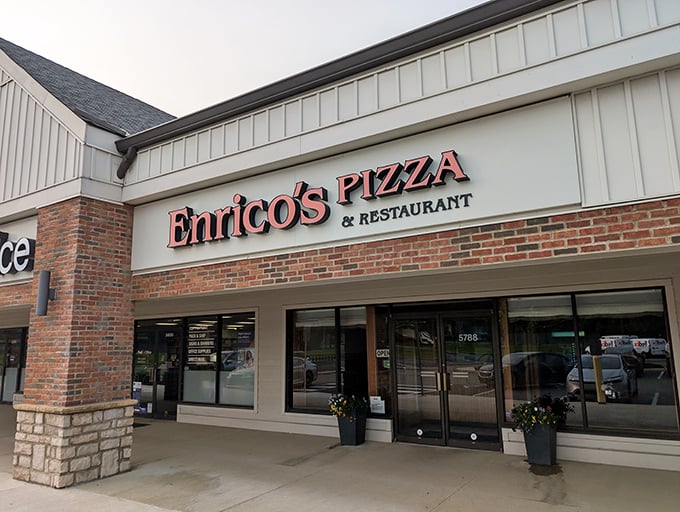 The storefront that launched a thousand carb cravings. Enrico's brick facade promises pizza perfection waiting just beyond those doors.