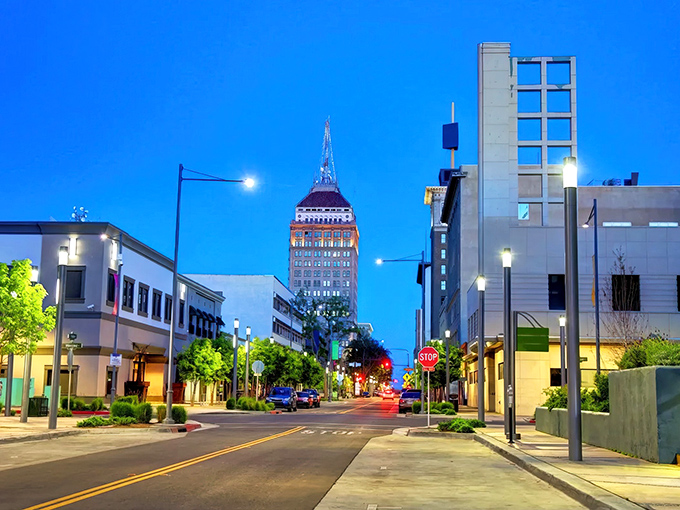Downtown Fresno at twilight, where the iconic Pacific Southwest Building stands tall against the evening sky. Affordable city living with historic charm.