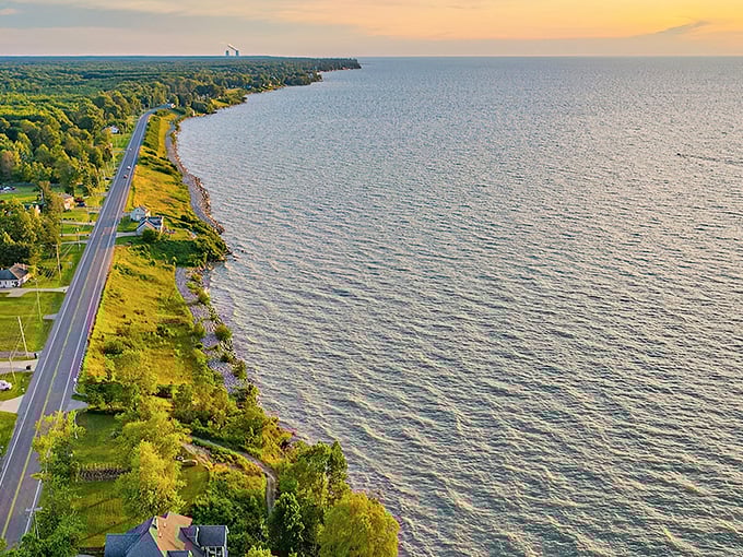 Sunset magic along Lake Erie's shore, where the road hugs the coastline like an old friend returning home.