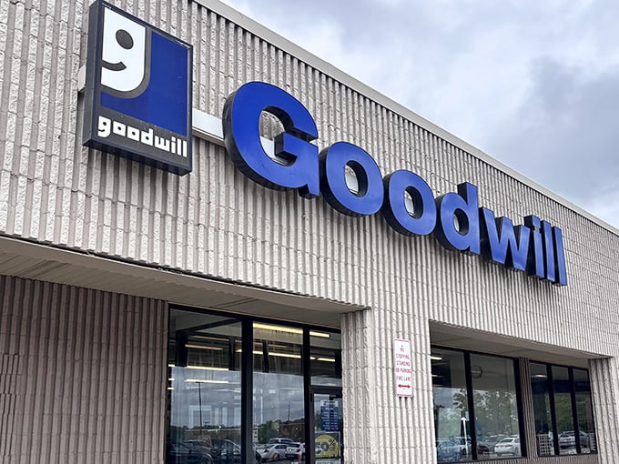 The iconic blue Goodwill sign beckons like a lighthouse for bargain hunters seeking treasures in Hermitage.