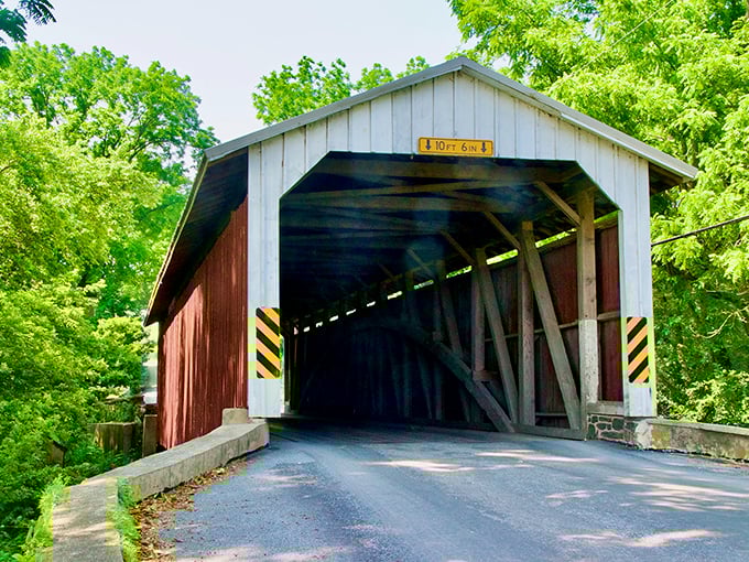 Red and white like a classic barn, Eshleman's Mill Bridge welcomes you with that "10 FT 6 IN" warning&mdash;the architectural equivalent of "duck!"
