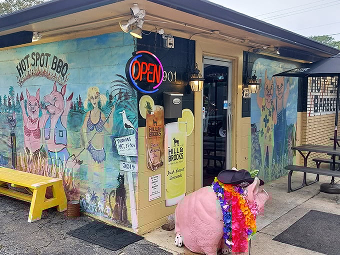 The colorful pig murals at Hot Spot BBQ aren't just decoration – they're a promise of the pork paradise waiting inside!