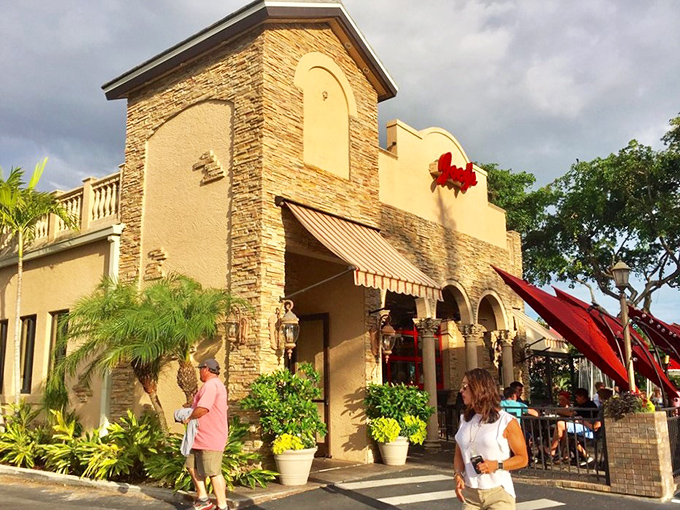 Joey's Pizza exterior beckons with Mediterranean charm. That stone facade isn't just pretty&mdash;it promises authentic flavors waiting inside.