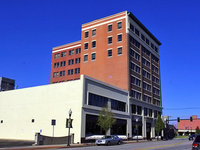 Historic brick buildings in downtown Joplin stand tall against a blue sky, offering affordable charm and character for budget-conscious residents.