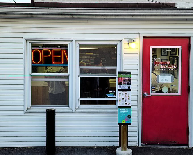 The unassuming exterior of Krumpe's hides donut magic within. That red door might as well be a portal to pastry paradise!