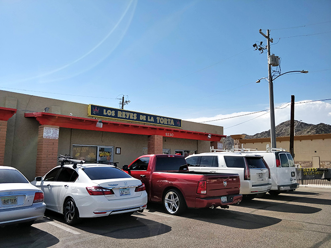 Los Reyes de la Torta's unassuming storefront hides a kingdom of flavor. The full parking lot tells you everything you need to know!