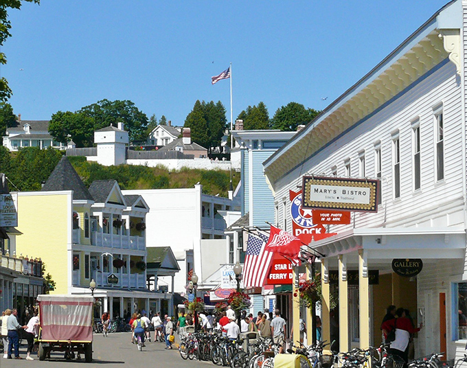 No cars allowed! Bicycles and horse-drawn carriages rule Mackinac Island's streets, creating a peaceful step back into simpler times.