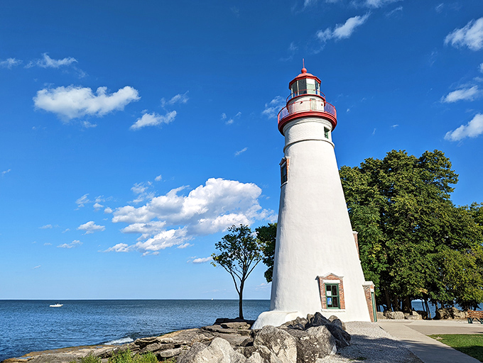 Marblehead Lighthouse stands tall against a perfect blue sky, like nature's exclamation point on Lake Erie's shoreline.