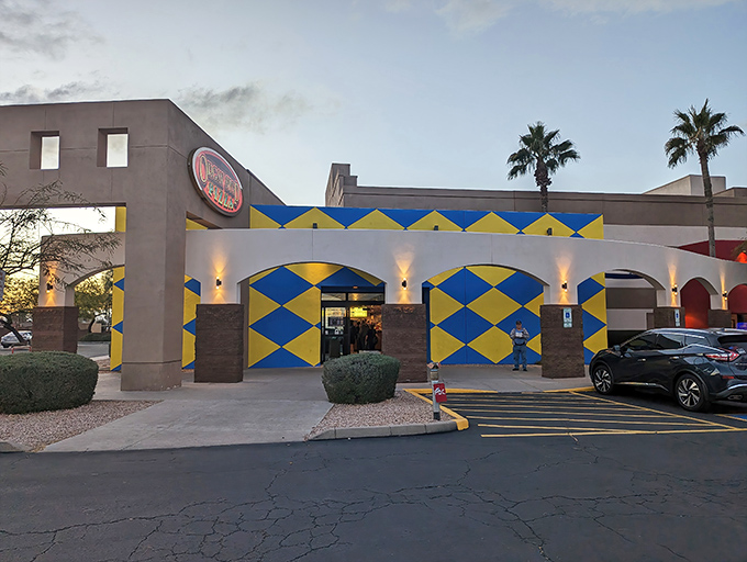 The blue and yellow checkerboard facade of Organ Stop Pizza isn't subtle, but neither is the massive Wurlitzer organ waiting inside!