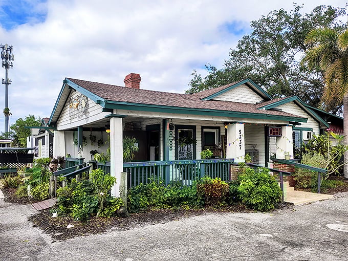 This weathered cottage with its welcoming porch practically whispers "come in, roll up your sleeves, and get deliciously messy!"