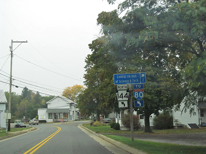 Route 144 welcomes travelers with its small-town charm. Those yellow lines might as well be saying "adventure this way!"
