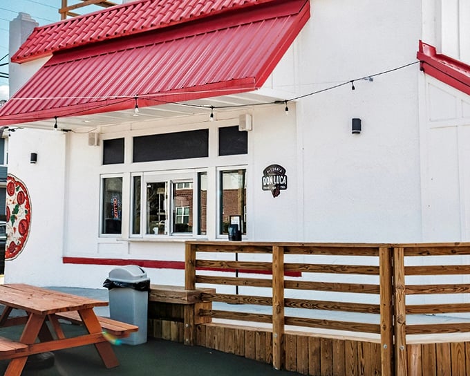 That red roof isn't just for show - it's like a beacon calling all pizza lovers home. 