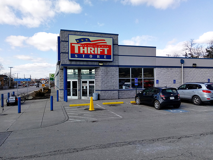 The Red White & Blue Thrift Store stands proud like a bargain-hunting castle. Its blue and red sign beckons treasure seekers from miles around.
