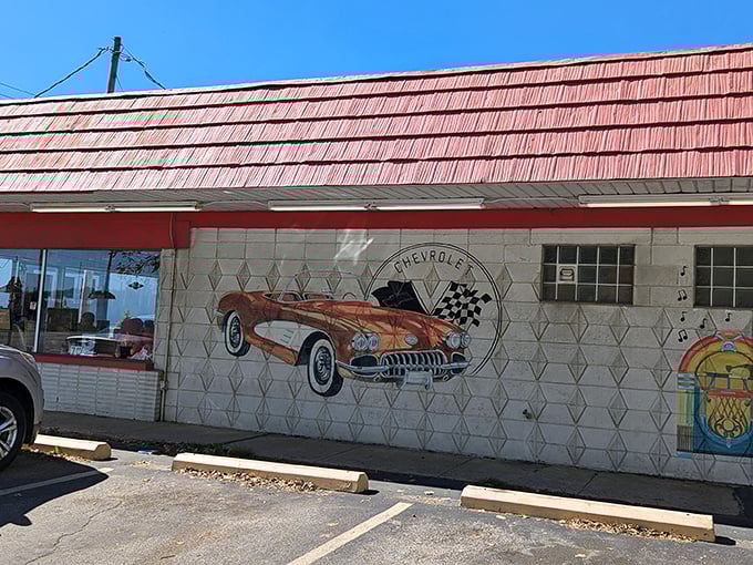 The classic Chevy mural at Rock-Cola 50's Cafe isn't just decoration&mdash;it's a time portal to when cars had fins and milkshakes had personality.
