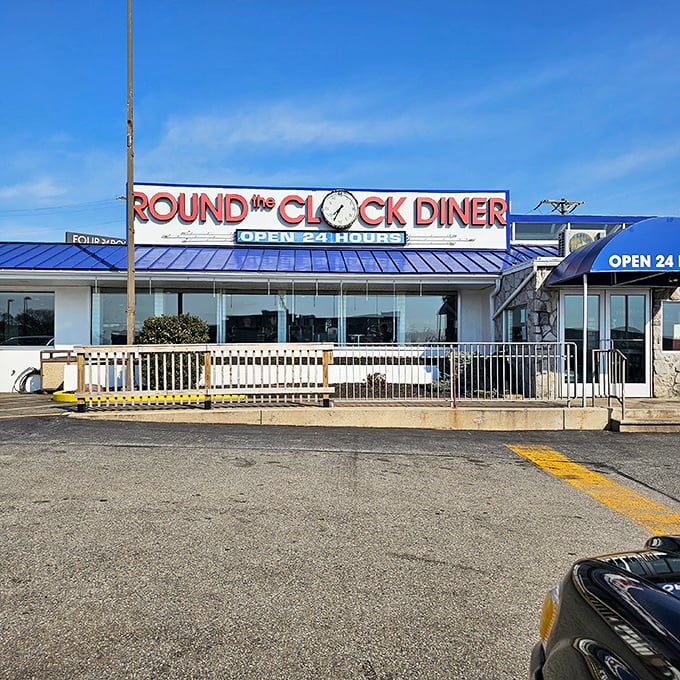 The iconic blue roof of Round the Clock Diner beckons hungry travelers 24/7. Where insomnia meets breakfast for dinner!