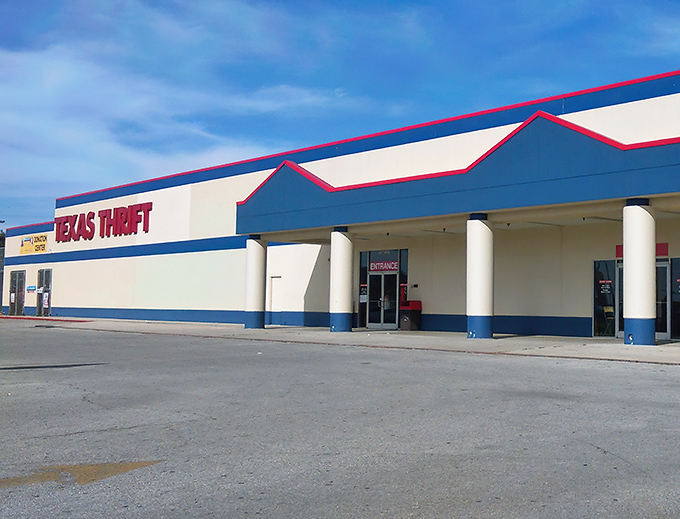 The blue and red exterior of Texas Thrift stands like a bargain beacon in Windcrest, promising treasures within its unassuming walls.
