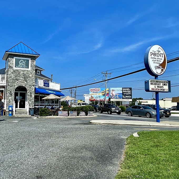 The Point Coffee House's stone tower stands like a caffeinated lighthouse, beckoning beach-goers with promises of liquid energy and pastry treasures.