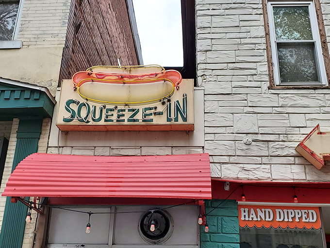 The Squeeze-In's vintage neon hot dog sign promises exactly what you need &ndash; a delicious reason to squeeze into this tiny Sunbury landmark.
